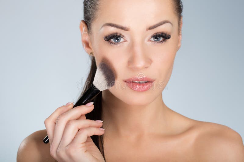 Young Beautiful Woman Applying Face Powder Stock Image - Image of happy ...