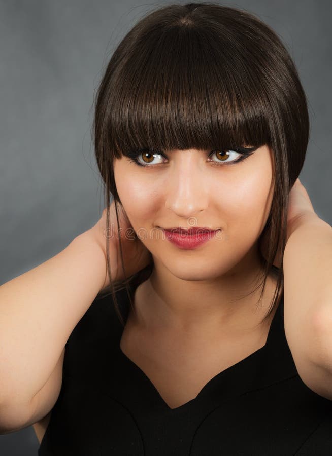 Young Beautiful Woman with Bangs in Studio Stock Photo - Image of ...
