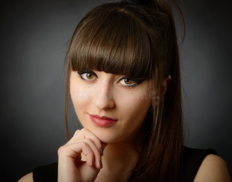 A Young Beautiful Woman with Bangs in Studio Stock Photo - Image of ...