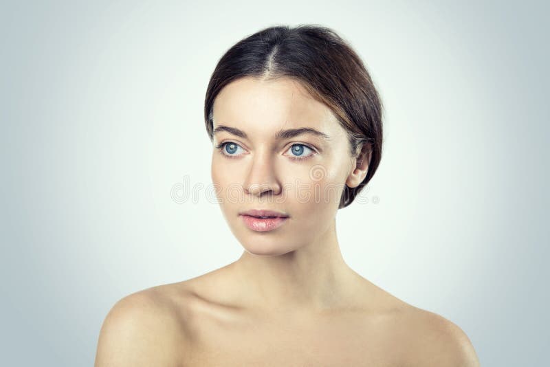 Young Beautiful Woman With Bare Shoulders Beauty Portrait On A Light