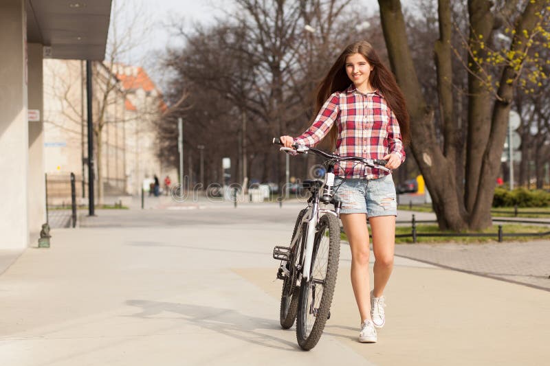 Young Beautiful Woman on a Bicycle Stock Photo - Image of street ...