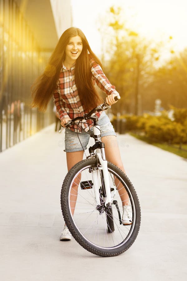 Young Beautiful Woman on a Bicycle Stock Image - Image of person, smile ...