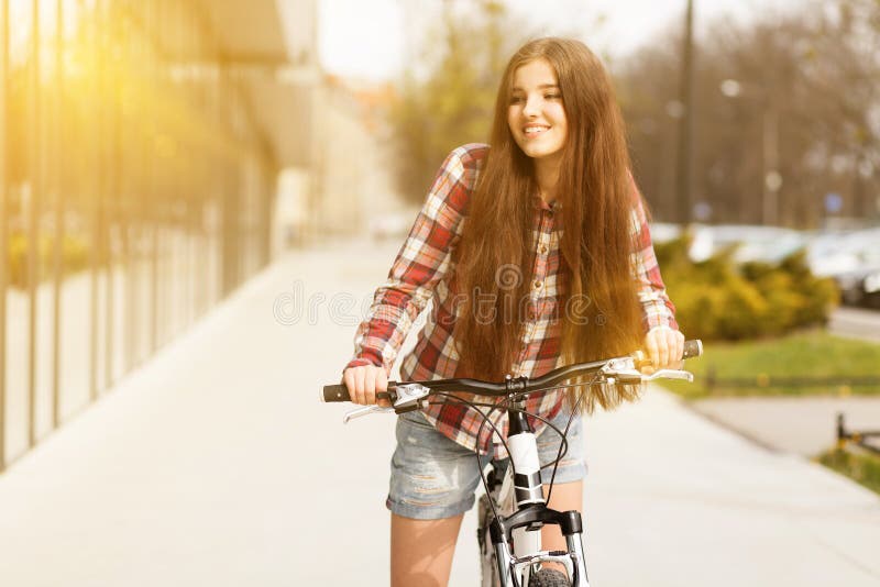 Young Beautiful Woman on a Bicycle Stock Photo - Image of hair, cycling ...