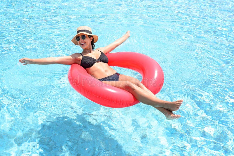Young Beautiful Woman In Bikini Wear Hat And Sunglasses Relaxing In