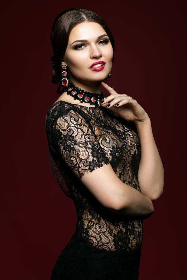 Young Beautiful Woman In Black Dress On Marsala Color Background Stock ... Young Beautiful Woman In Black Dress On Marsala Color Background Stock ...
