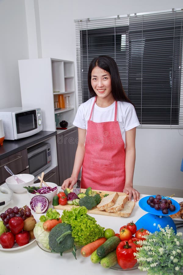 Young Beautiful Woman Cooking in Kitchen Room Stock Photo - Image of ...