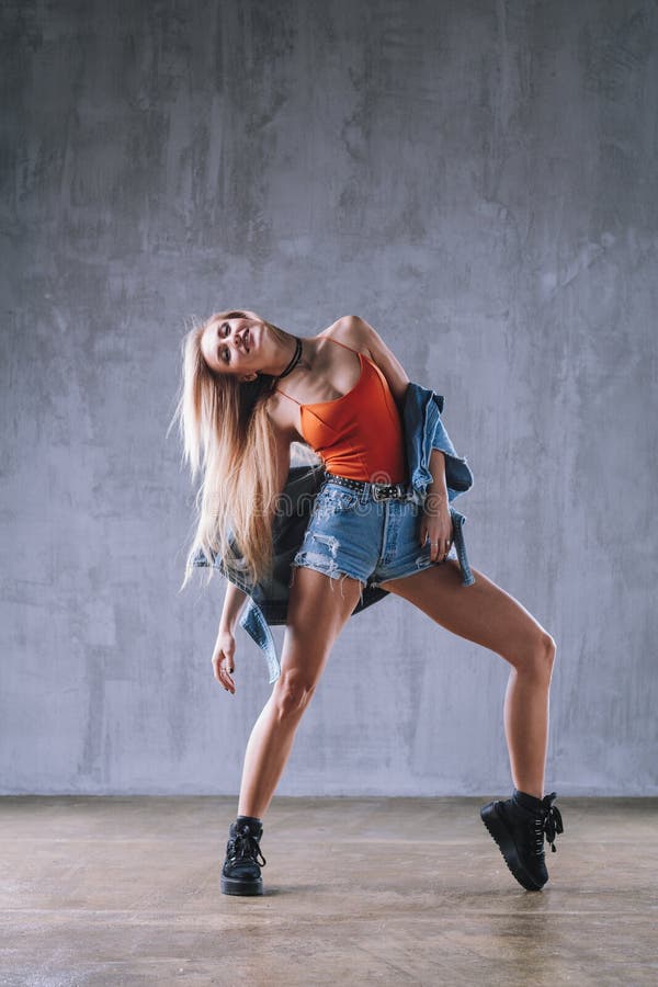 Young Beautiful Female Dancer is Posing in the Studio Stock Image ...