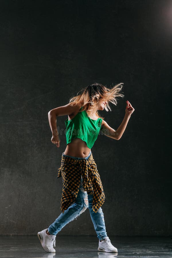 Young Beautiful Female Dancer is Posing in the Studio Stock Image ...