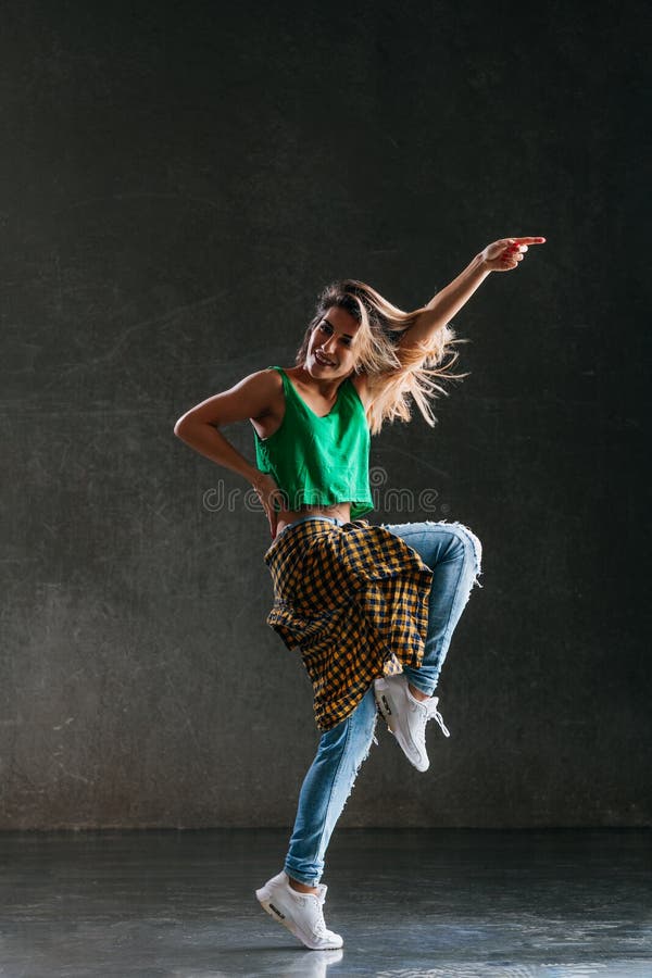 Young Beautiful Female Dancer is Posing in the Studio Stock Image ...
