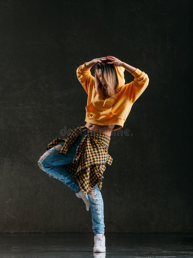 Young Beautiful Female Dancer is Posing in the Studio Stock Image ...