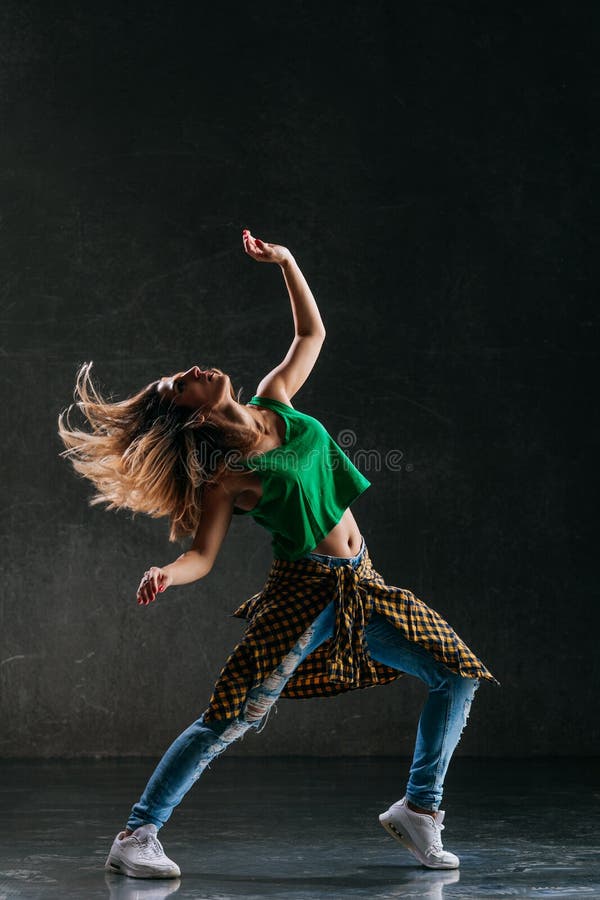 Young Beautiful Female Dancer is Posing in the Studio Stock Image ...