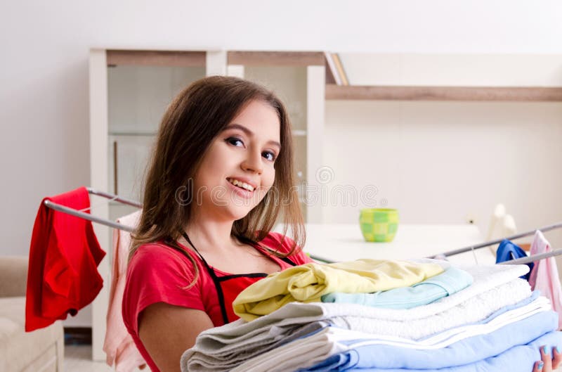 The Young Beautiful Woman Doing Laundry at Home Stock Photo - Image of ...