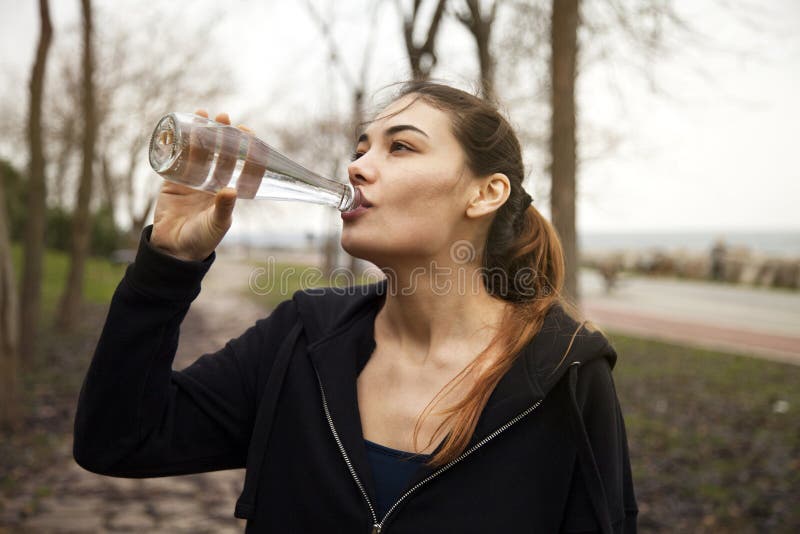Young Beautiful Woman Drink Water in Outdoors Stock Photo - Image of ...