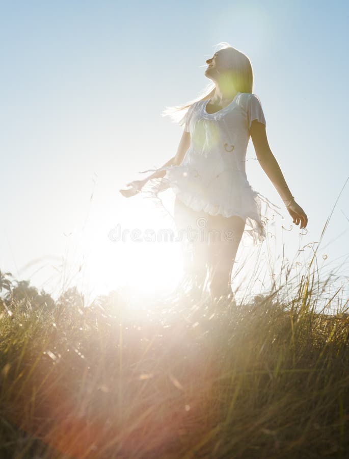 Beautiful Woman in a Field Being Carefree. Stock Image - Image of ... Beautiful Woman in a Field Being Carefree. Stock Image - Image of ...