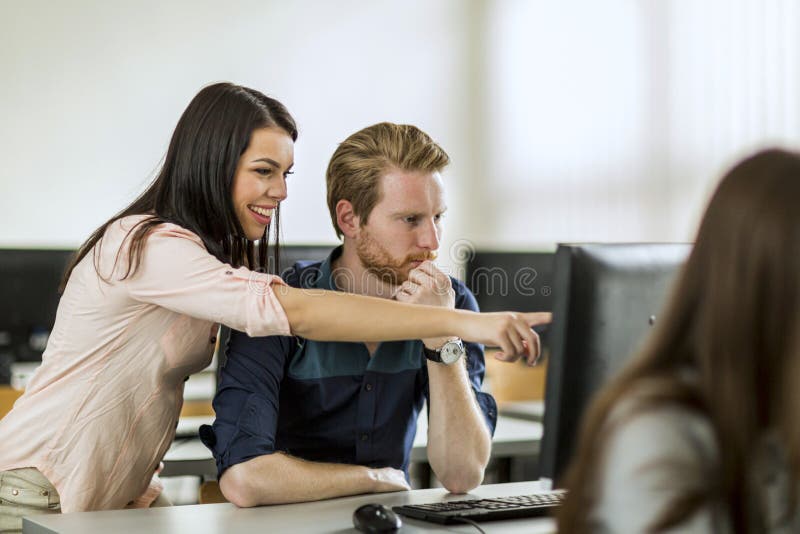 Young Beautiful Woman Helping Classmate Understand Stock Image - Image ...