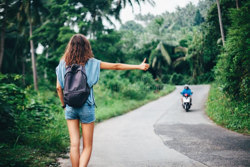 Young Beautiful Woman Hitchhiking Standing On Road Stock Image Image