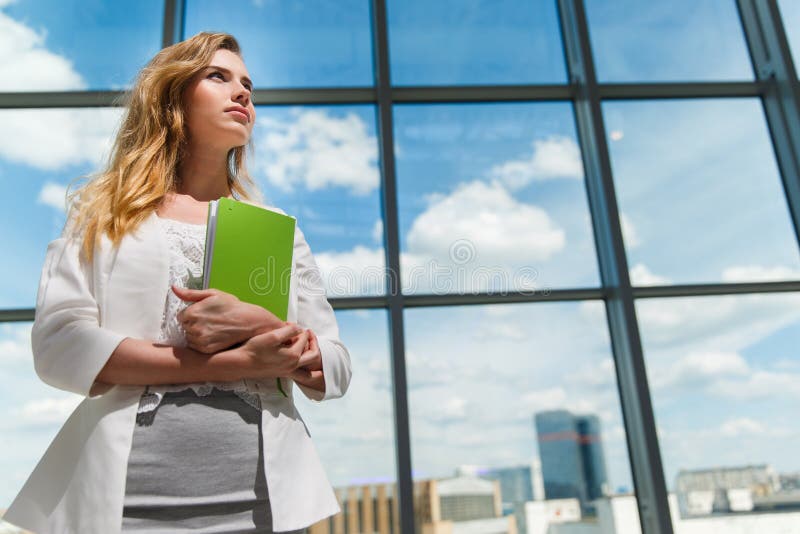 Young Beautiful Woman Holding Green Notebook. Stock Photo - Image of ...