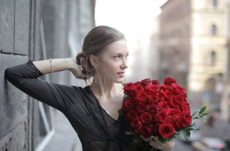Young Beautiful Woman Holding Red Roses Stock Image - Image of love ...