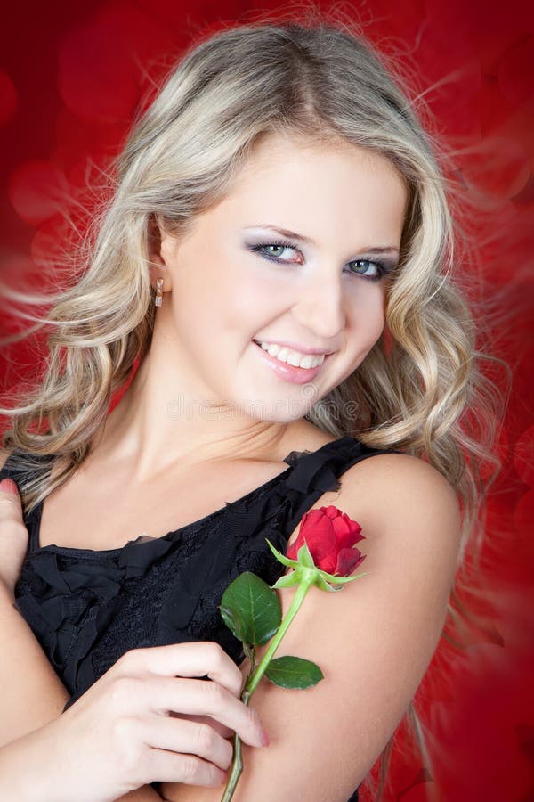 Young Beautiful Woman Holding Flower in Her Hands Stock Photo - Image ...