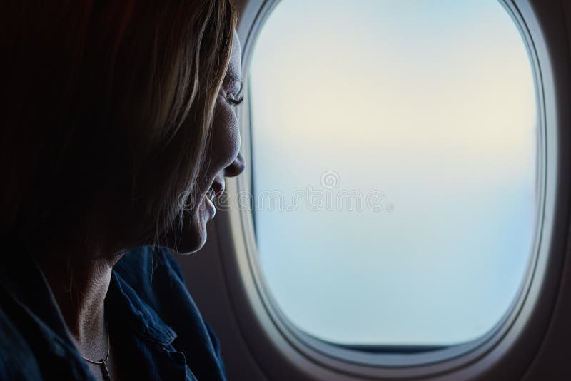 Young Beautiful Woman Looking into Airplane Window Stock Image - Image ...
