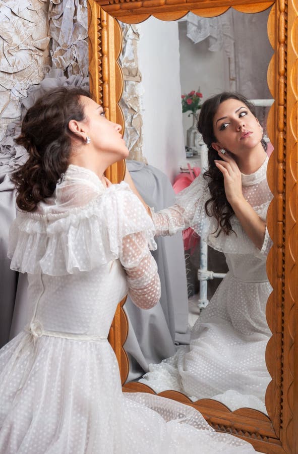 Young Beautiful Woman Looking Into A Mirror Stock Image Image 32241137