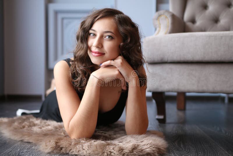 Young Beautiful Woman Lying on Polished Floor in Studio Stock Photo ...