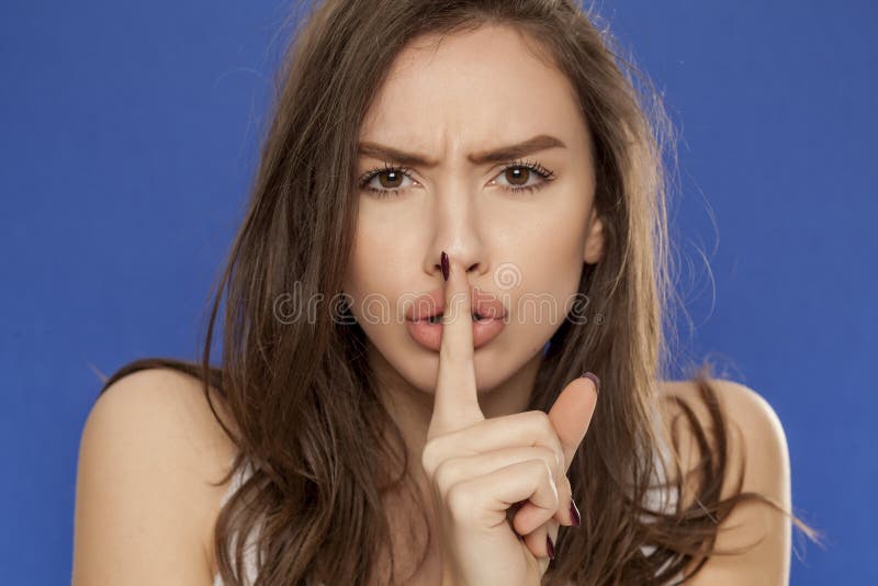 Silence gesture stock photo. Image of shhh, blue, young - 118401114