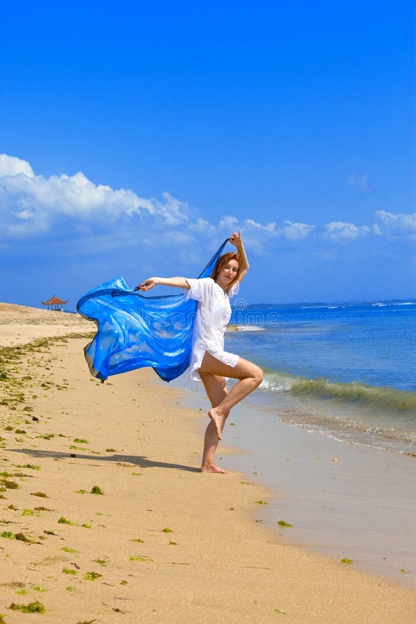 The Young Beautiful Woman on an Ocean Coast. Stock Photo - Image of ...