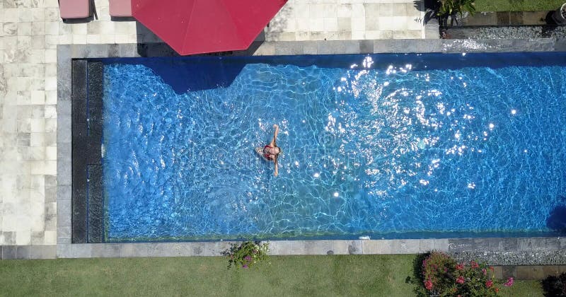 The Young Beautiful Woman in the Pool, Flat Lay, Dron View Stock Photo ...