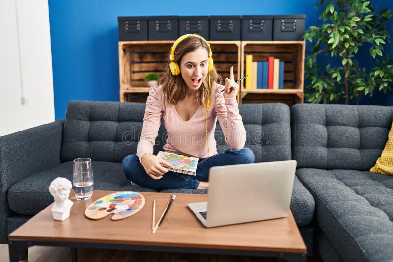 Young Beautiful Woman Practicing Painting Looking at Online Tutorial ...