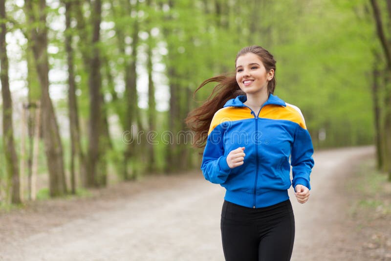 Young Beautiful Woman Running on a Trail Stock Image - Image of athlete ...
