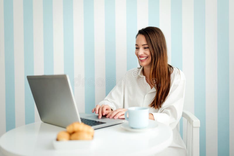 Young Beautiful Woman Smiling and Using Laptop Stock Photo - Image of ...