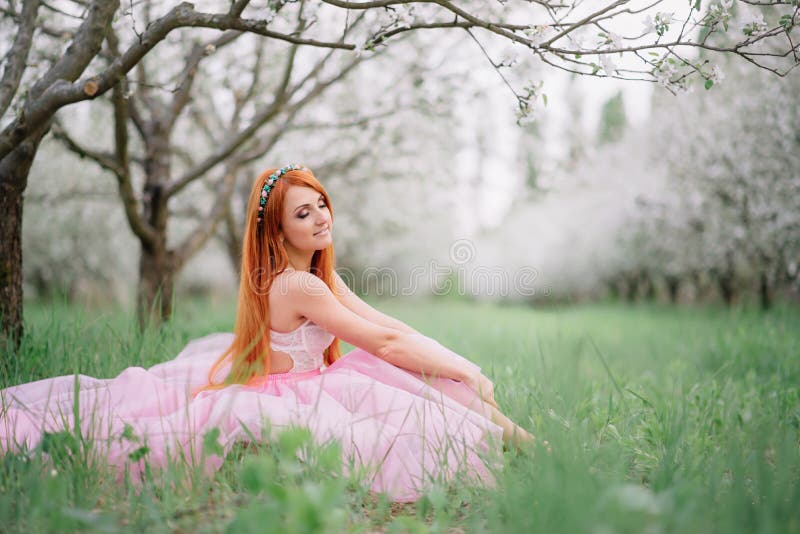 Young Beautiful Woman in the Spring Garden Stock Photo - Image of ...