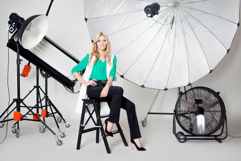 Young Beautiful Woman in Studio, Lighting Spotlights on the Background ...