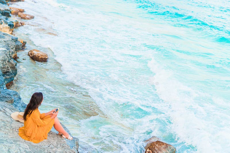 Young Beautiful Woman in Sunset Background of Ocean Stock Photo - Image ...