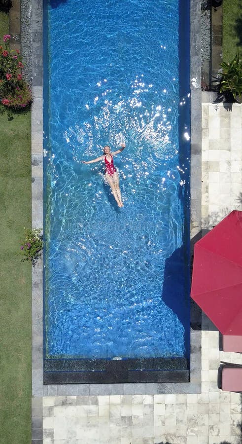The Young Beautiful Woman Swims in the Pool, Flat Lay, Dron View. Stock ...