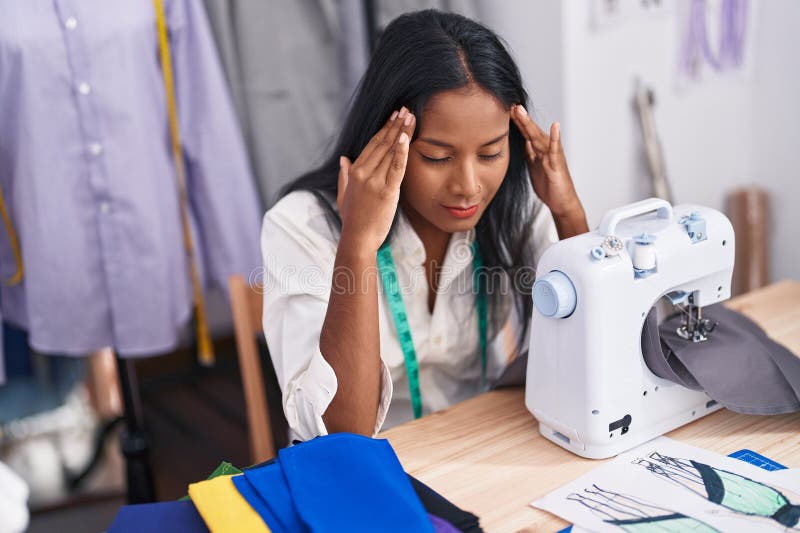 Young Beautiful Woman Tailor Stressed Using Sewing Machine at Tailor ...