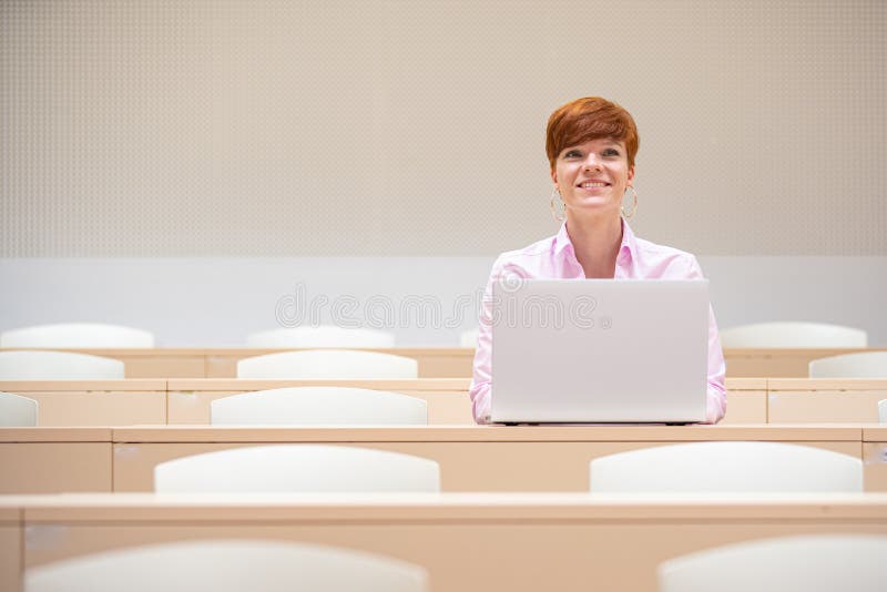 Young Beautiful Woman on a University Lecture Working on a Laptop Stock ...