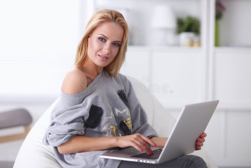 Young Beautiful Woman Using a Laptop Computer at Stock Photo - Image of ...