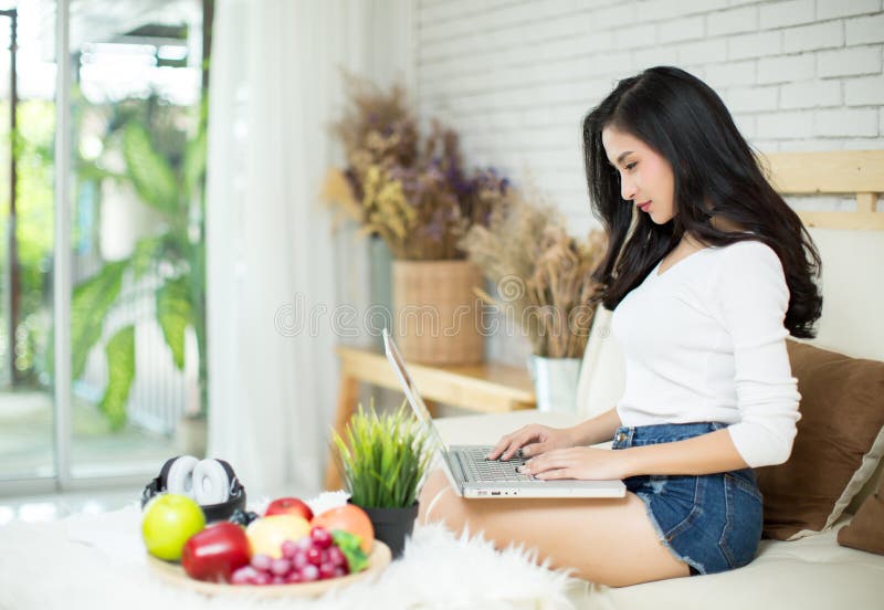 Young Beautiful Woman Using a Laptop Computer Stock Image - Image of ...