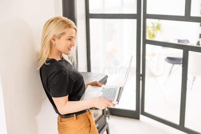 Young Beautiful Woman Using a Laptop Computer at Home Stock Photo ...