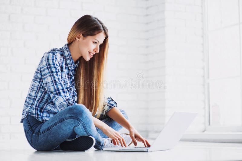 Young Beautiful Woman Using a Laptop Computer at Home Stock Image ...