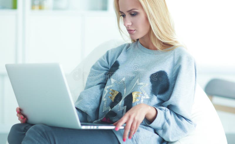 Young Beautiful Woman Using a Laptop Computer at Home Stock Photo ...