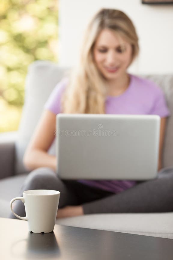Young Beautiful Woman Using a Laptop at Home Stock Photo - Image of ...