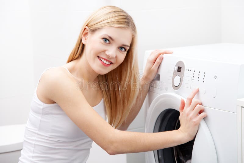 Happy Housewife Woman in Laundry Room with Washing Machine Stock Image ...