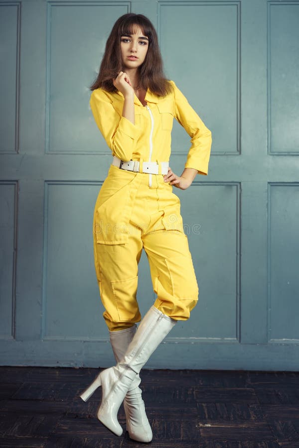 Young Beautiful Woman in Yellow Work Suit Stock Image - Image of ...