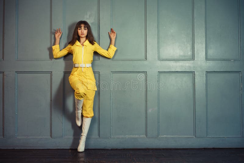 Young Beautiful Woman in Yellow Work Suit Stock Photo - Image of ...
