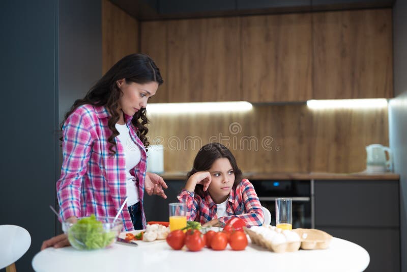 Young Beautiful Woman Having An Argument With Her Teen Daughter During