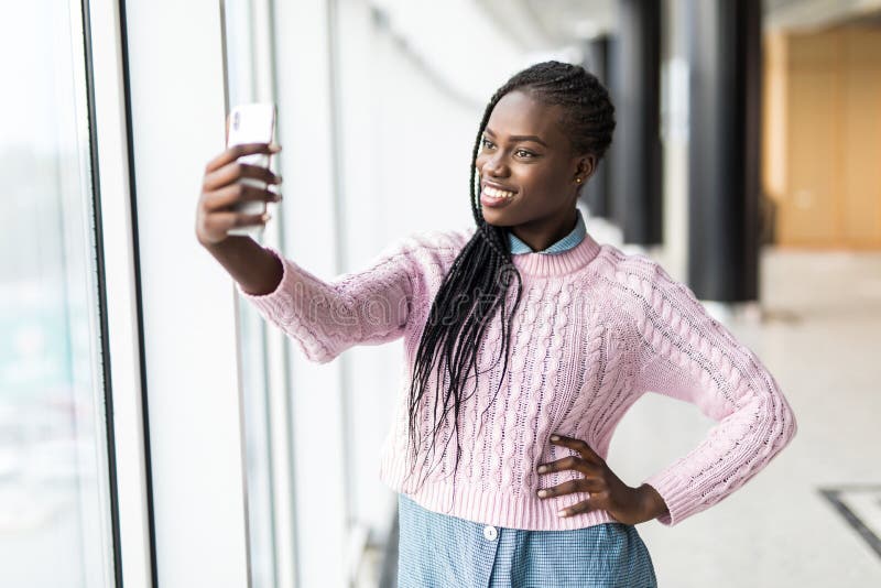 Young Beauty African Woman Take Selfie On Mobile Phone In Front Of