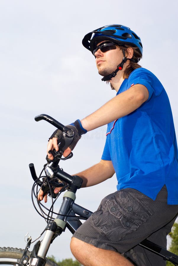 Young bicyclist in helmet stock photo. Image of pursuit - 13387756